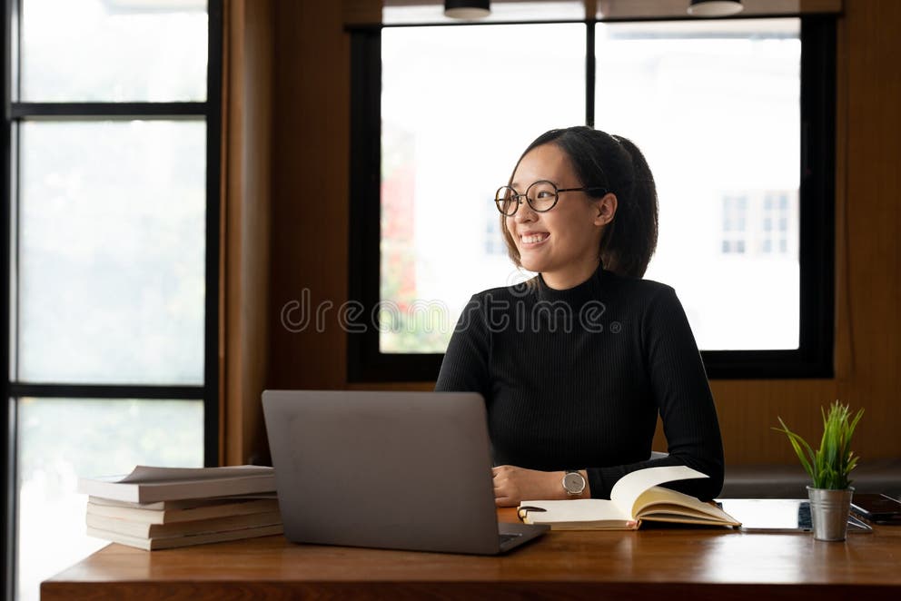 Female Student Study in the School Library.she Using Laptop and ...
