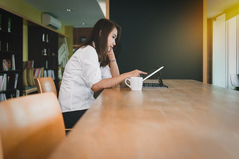 Female Student Study in School Library, Using Tablet, Laptop and Stock ...