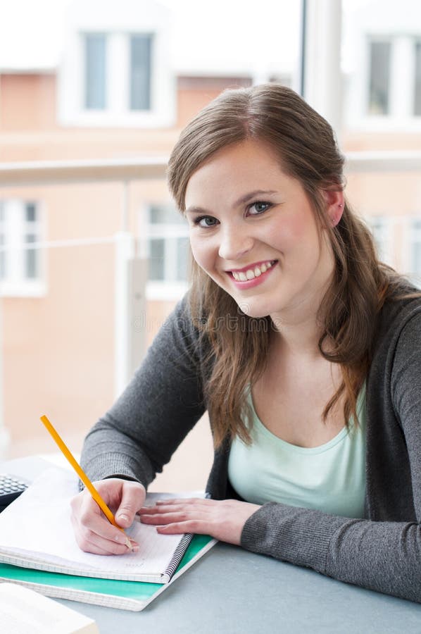 Female Teenage Student Studying in Classroom Stock Image - Image of ...