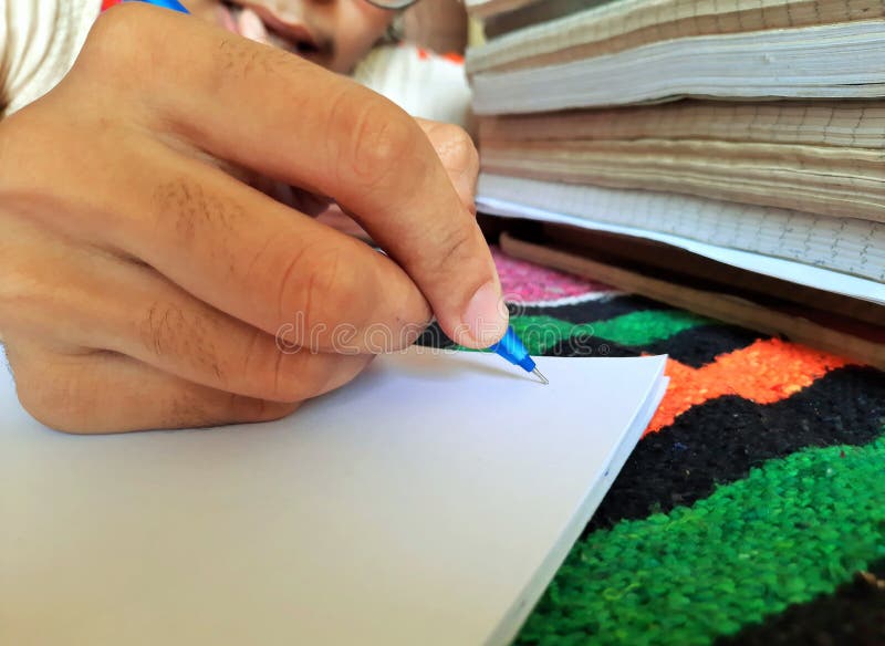 Female Student Studying Hard for Exams and Writing on Paper Stock Photo ...