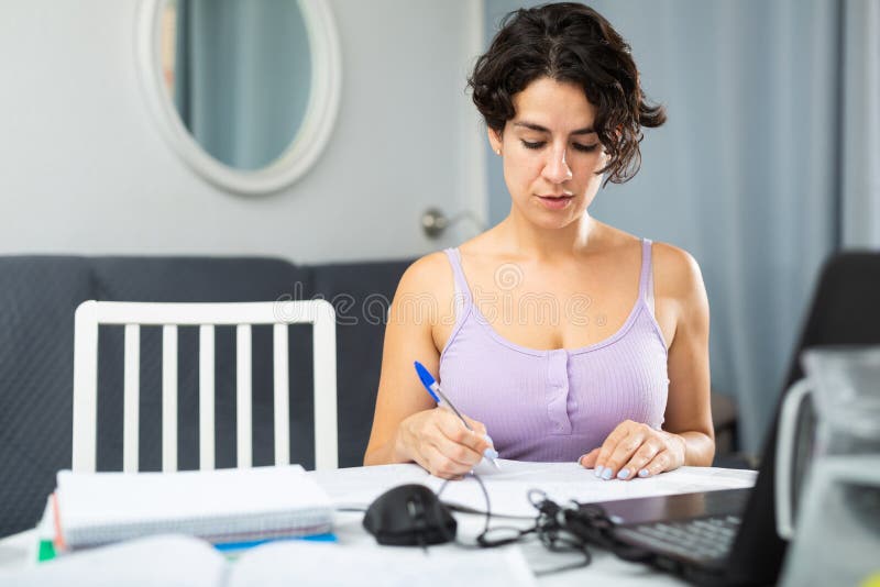 Female Student Studying at Home Using Laptop and Internet Stock Photo ...
