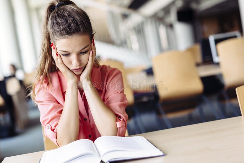 Female Student Studying in Library Stock Photo - Image of sitting ...