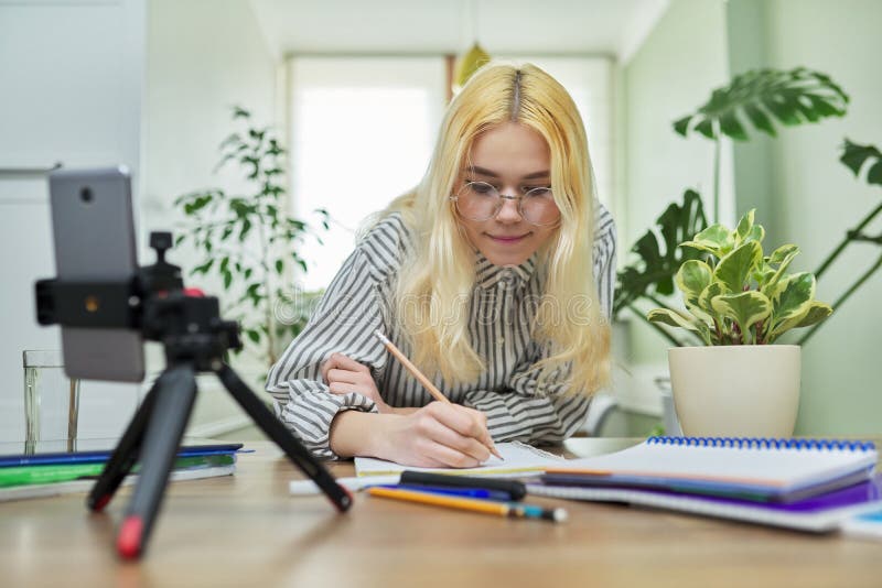 Female Student Teenager Studying at Home Online Using Smartphone. Stock ...