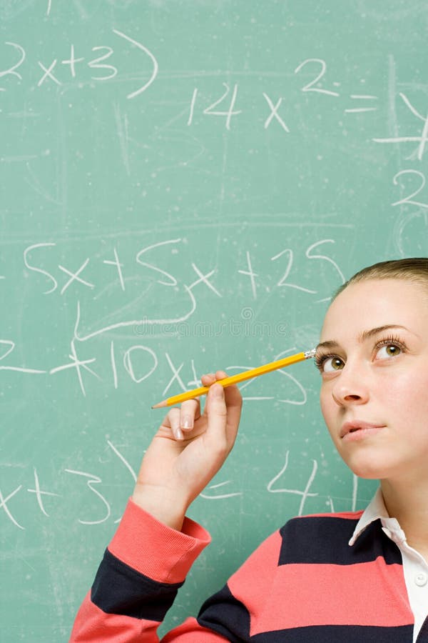 Female Student Trying To Solve Formula Stock Photo - Image of ethnicity ...