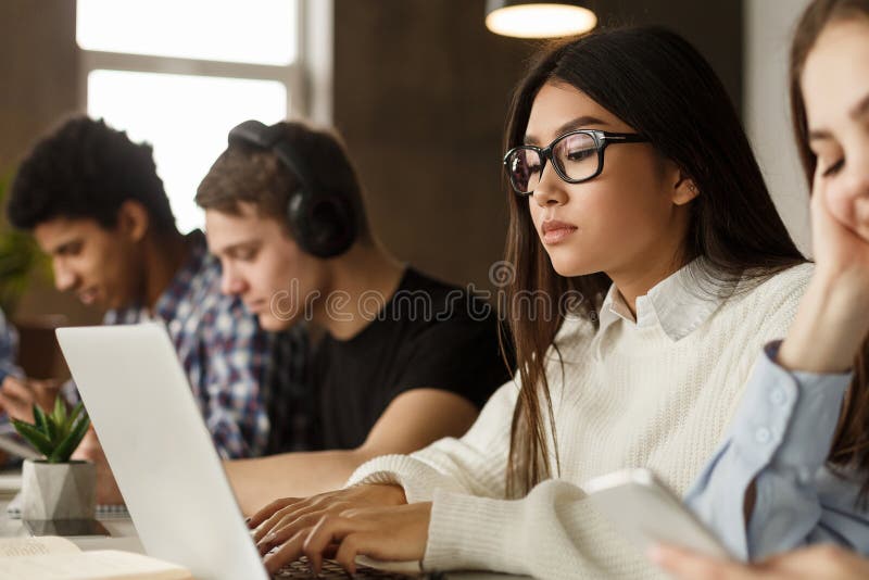 Female Student Typing on Laptop, Studying in Library Stock Image ...