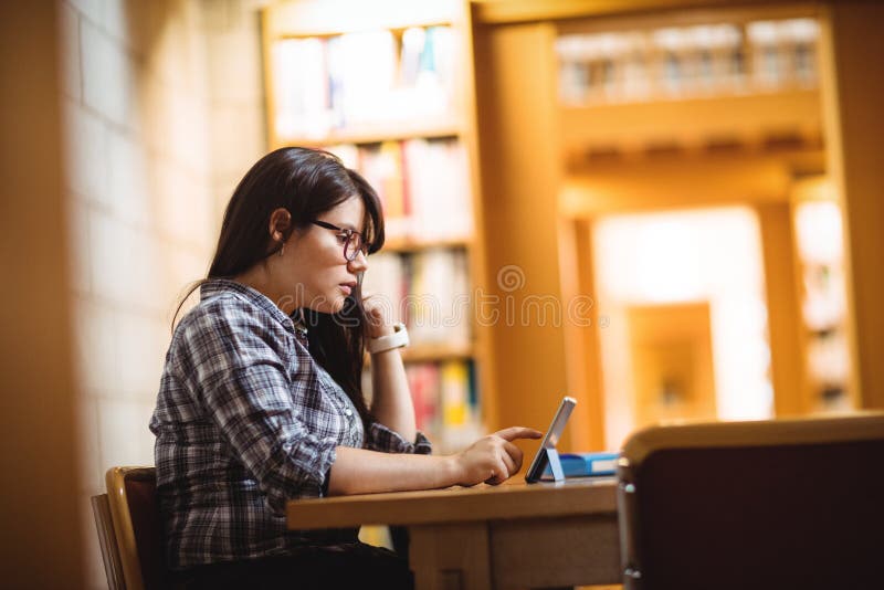 Female Student Using Laptop and Virtual Reality Headset in Library ...