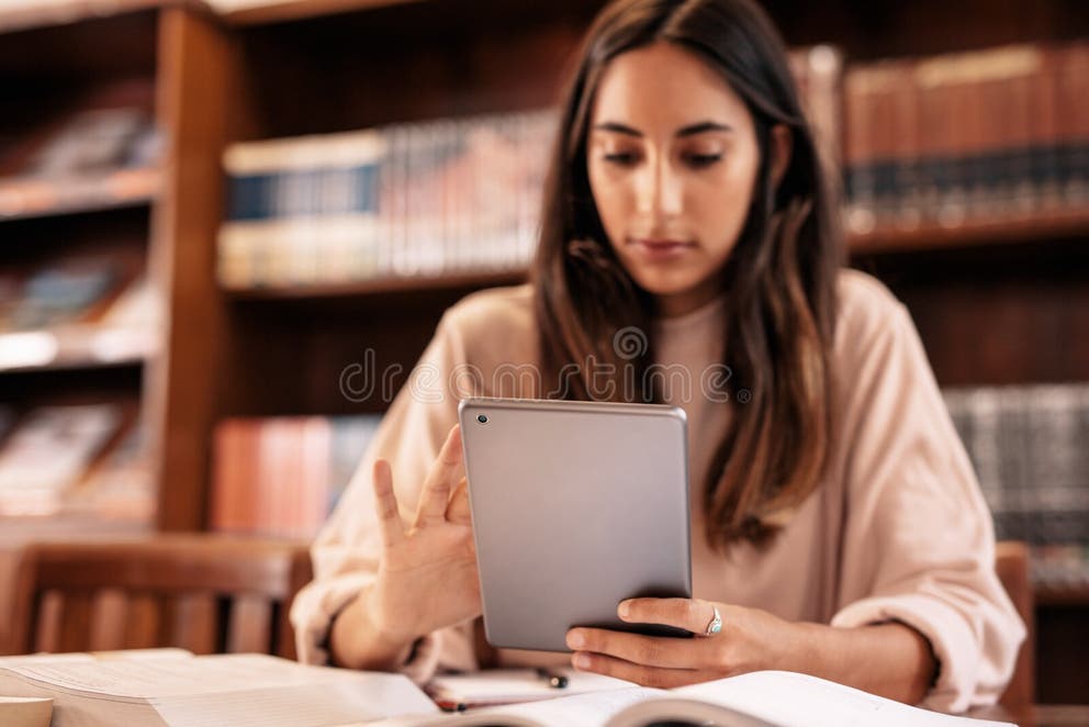 Female Student Using Digital Tablet in Library Stock Image - Image of ...