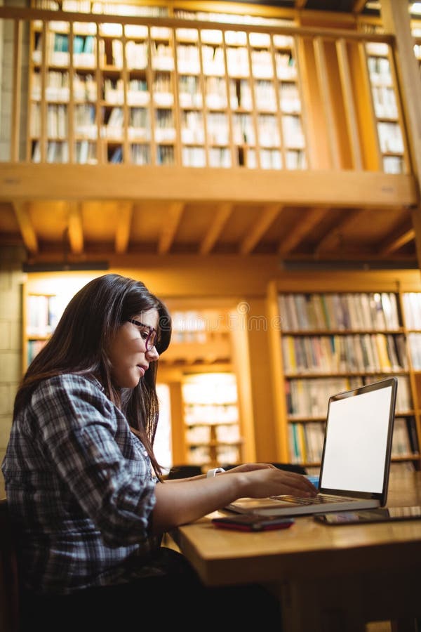 Female Student Using Laptop in Library Stock Image - Image of internet ...