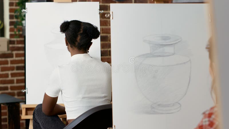 Female Student Using Pencil and Canvas To Create Artwork Stock Photo ...