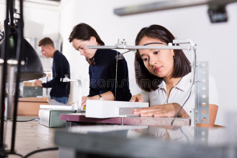 Female Student Using Scroll Saw in Architectural Modeling Stock Image ... Female Student Using Scroll Saw in Architectural Modeling Stock Image ...
