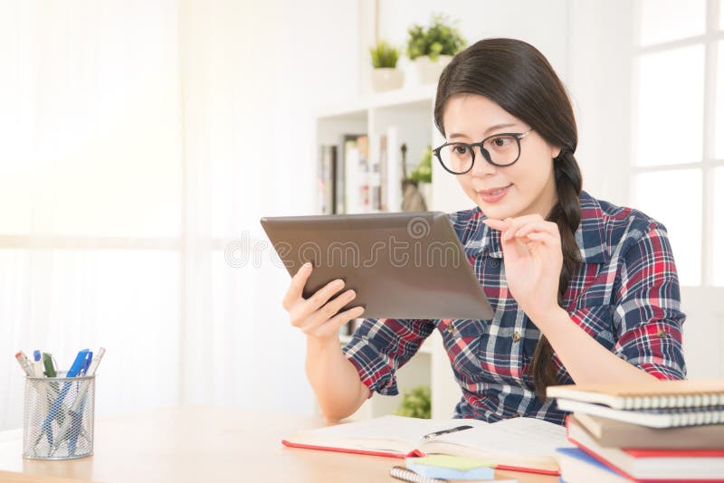Female Student Using a Tablet Computer Stock Photo - Image of research ...