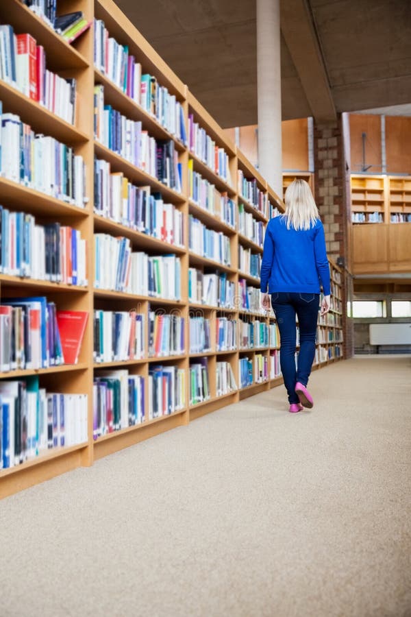 Female Student Walking in the Library Stock Image - Image of ...