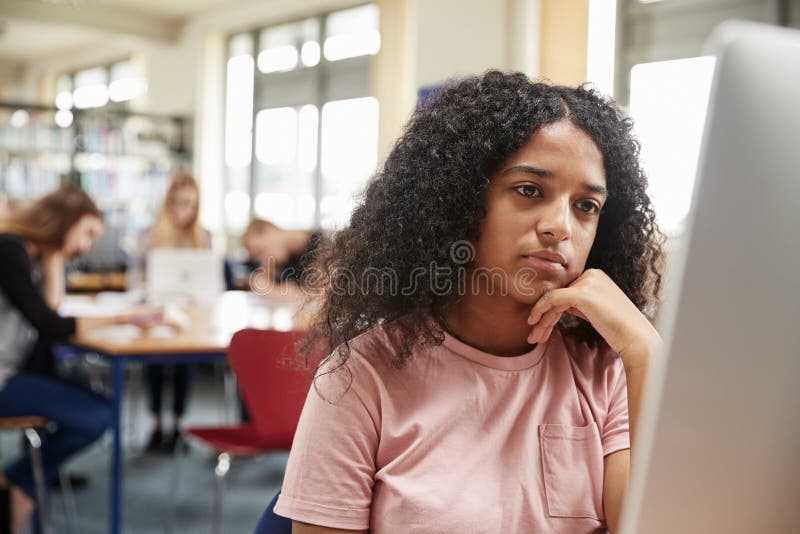 Female Student Working on Computer in College Library Stock Photo ...