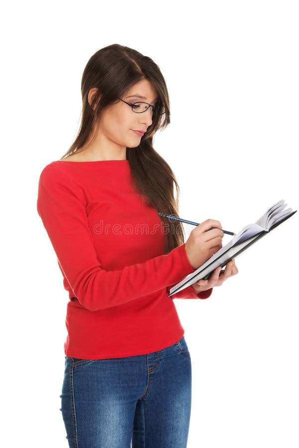 Female Student Writing in Notebook. Stock Photo - Image of learning ...