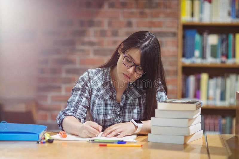 Female Student Writing Notes in Library Stock Image - Image of indoors ...