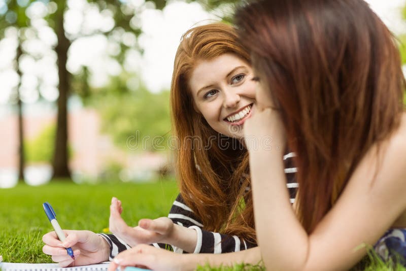 Female Students with Books in Park Stock Photo - Image of foreground ...