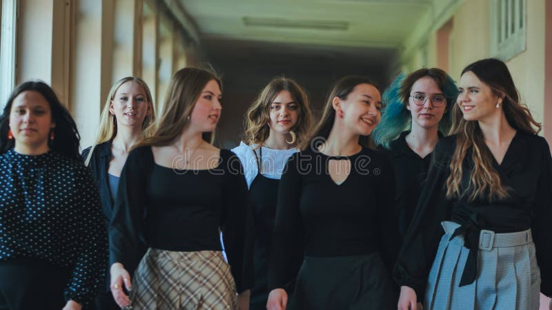 Female Students Chatting and Strolling through the School Hallway ...