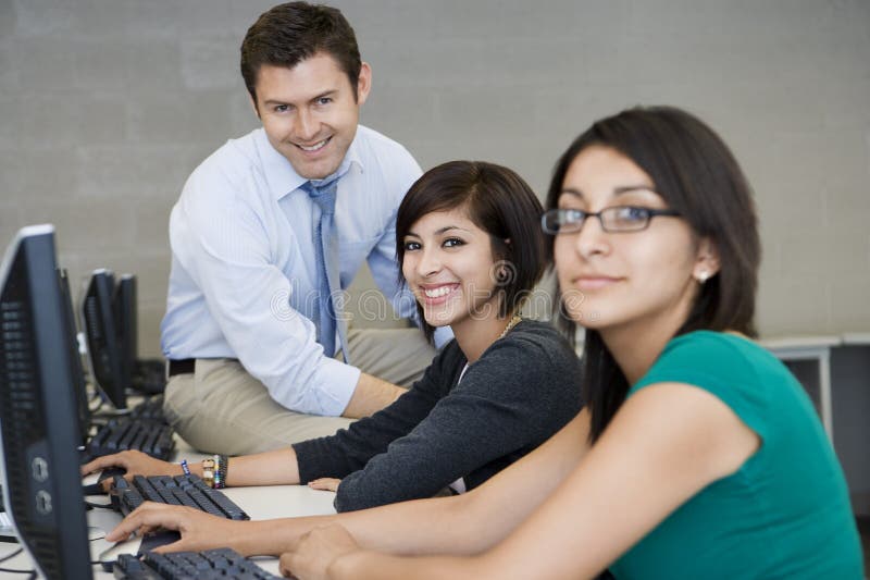 Female Students with Professor in Computer Lab Stock Photo - Image of ...