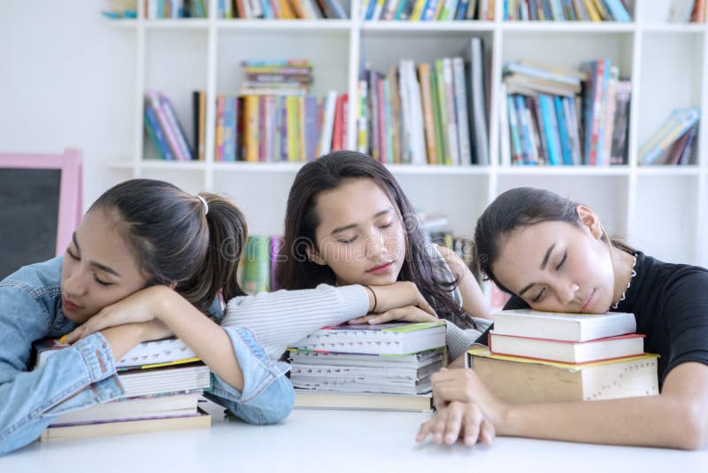 Female Students Sleeping during Study in Library Stock Photo - Image of ...