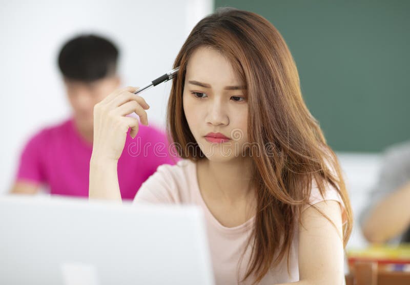 Female Students Thinking in Classroom Stock Photo - Image of school ...