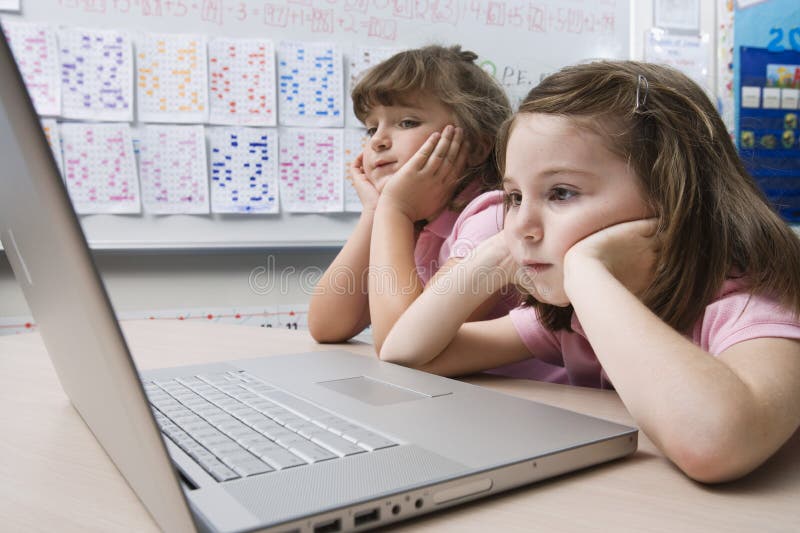 Female Students Using Laptop Stock Photo - Image of desk, childhood ...