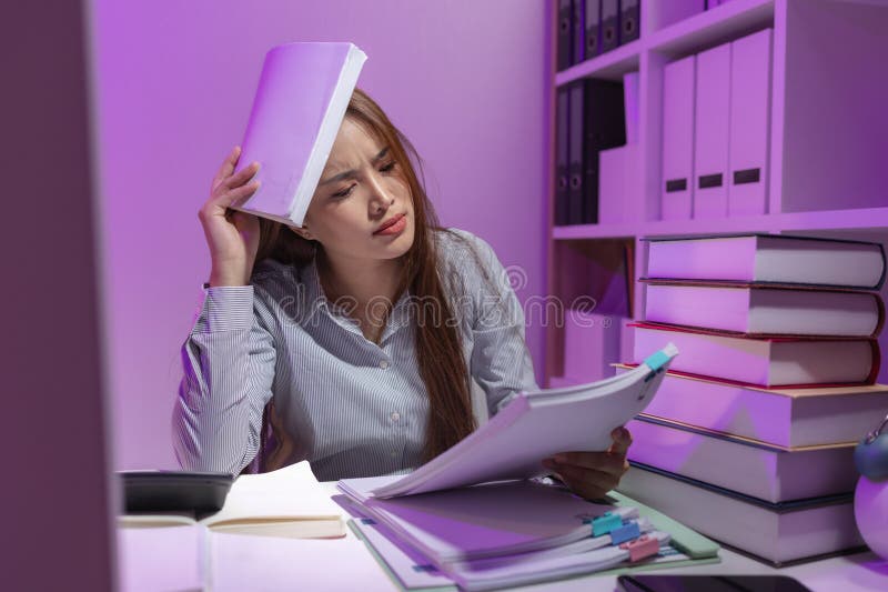 A Female Supervisor is Working Overtime at the Company Stressed because ...