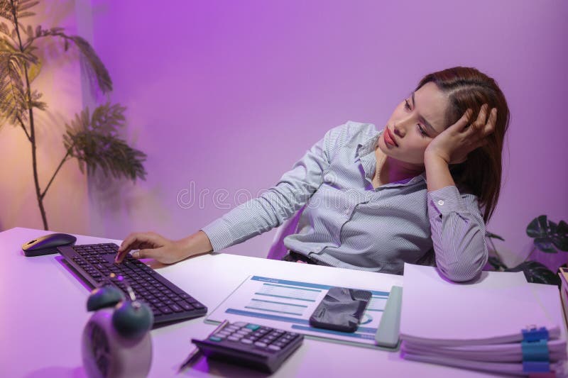 A Female Supervisor is Working Overtime at the Company Stressed because ...