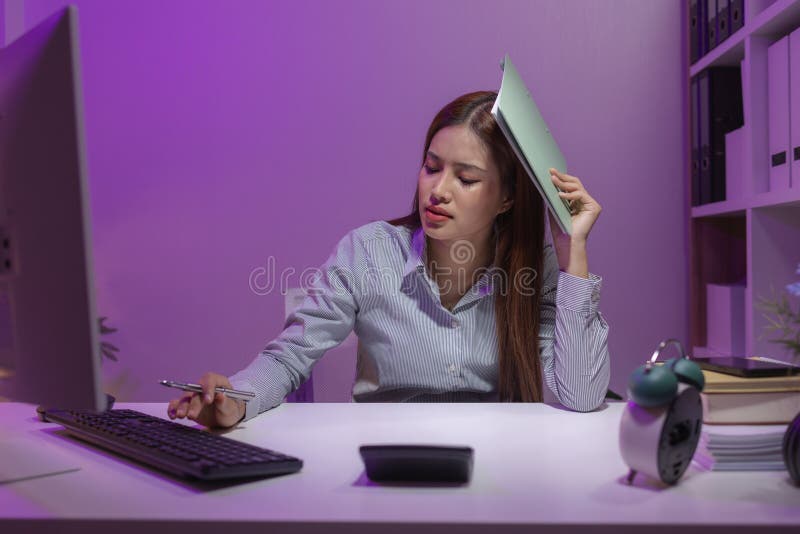 A Female Supervisor is Working Overtime at the Company Stressed because ...