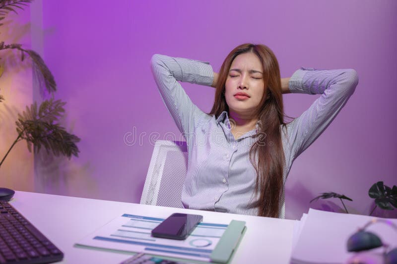 A Female Supervisor is Working Overtime at the Company Stressed because ...