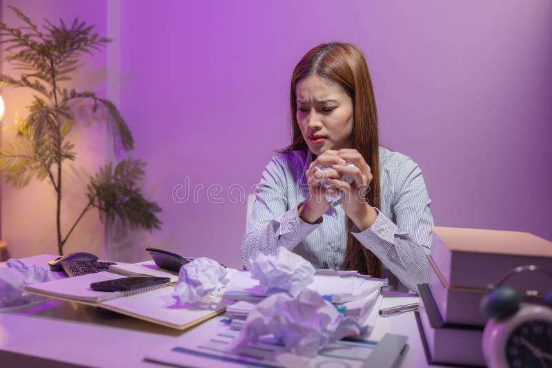 A Female Supervisor is Working Overtime at the Company Stressed because ...