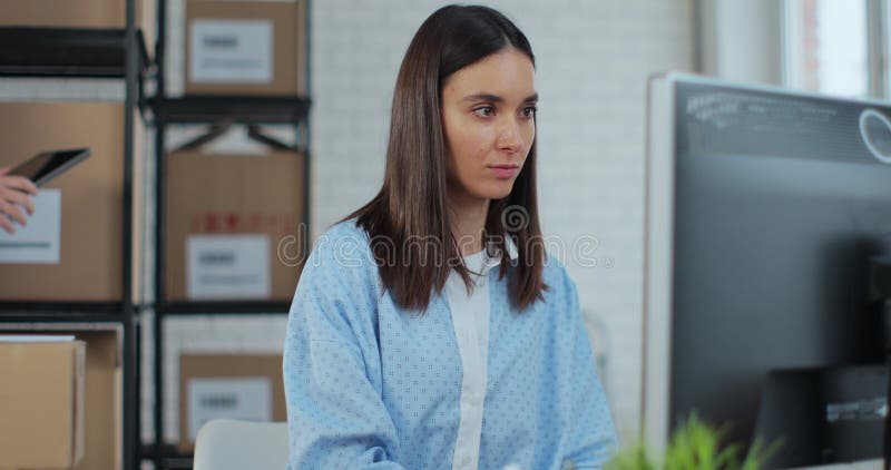 Female Support Service Manager Checks the Order Number on the Parcel ...