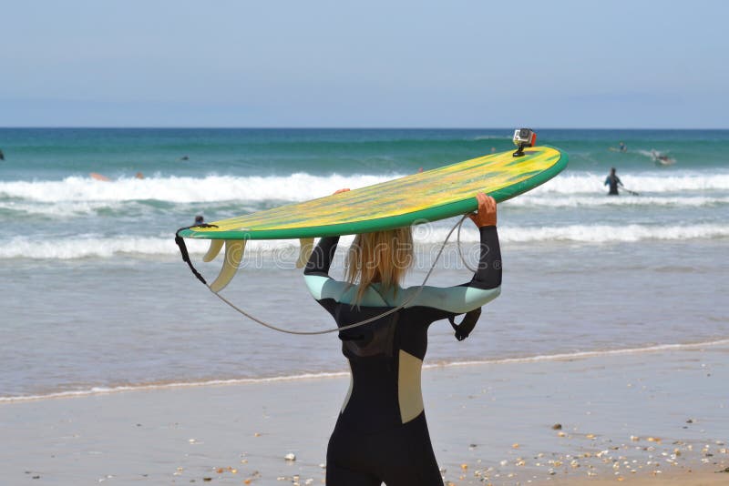 Female Surfer Heading Towards the Waves Stock Image - Image of blonde ...