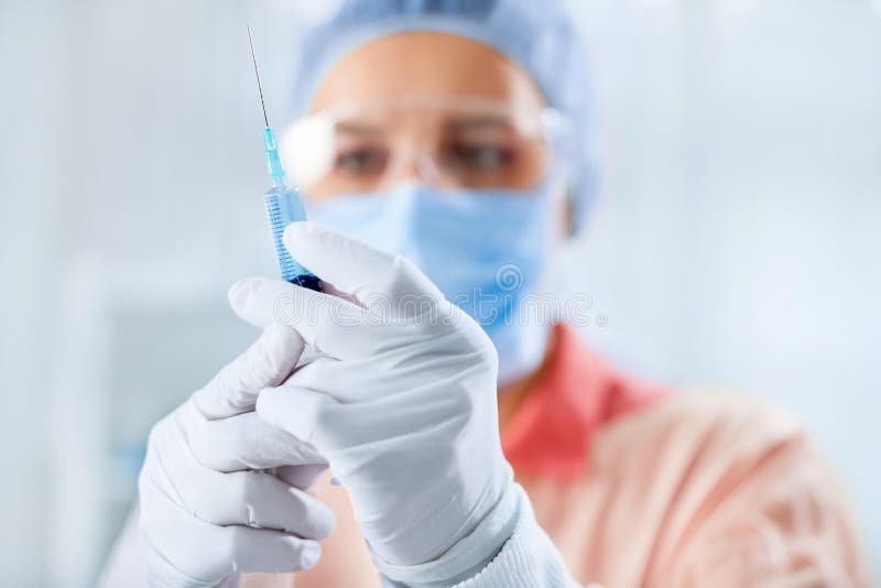 Female Surgeon Holding Syringe Stock Photo - Image of hospital, hand ... Female Surgeon Holding Syringe Stock Photo - Image of hospital, hand ...