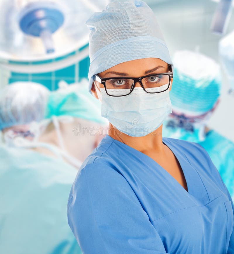 Female Surgeon with Surgical Team Stock Photo - Image of medical ...