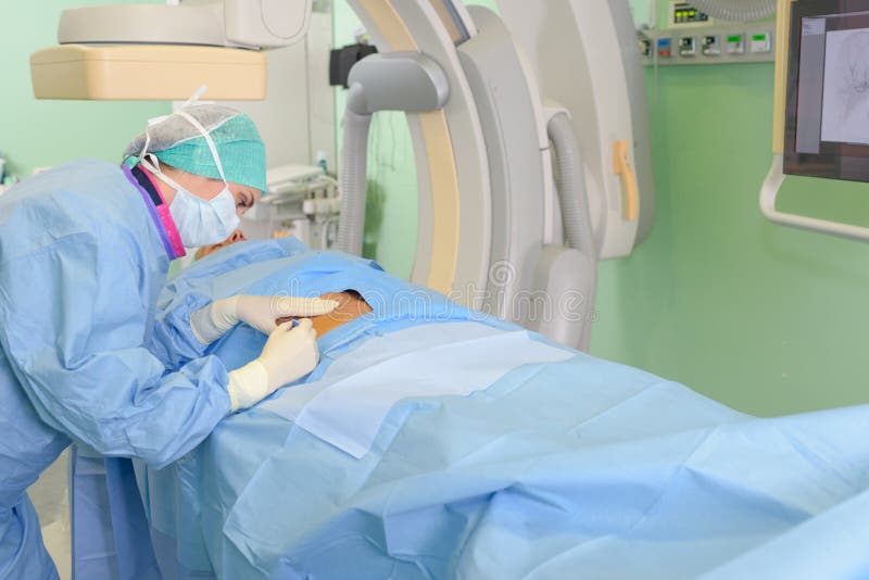 Female Surgeon Using Cell Phone in Hospital Stock Photo - Image of ...