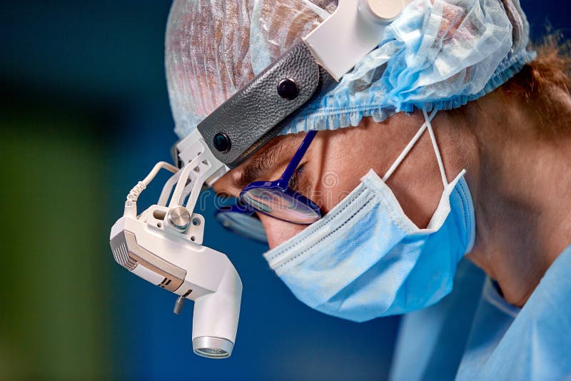 Female Surgeon in Operation Room with Reflection in Glasses Stock Photo ...