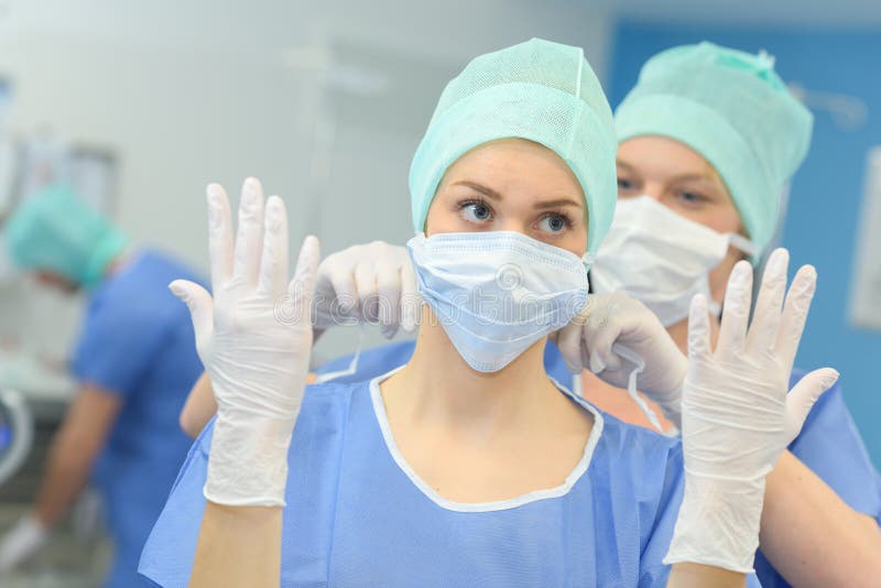 Female Surgeon Preparing for Surgery Stock Photo - Image of rubber ...