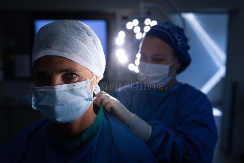 Female Surgeons Getting Ready before Operation Stock Photo - Image of ...