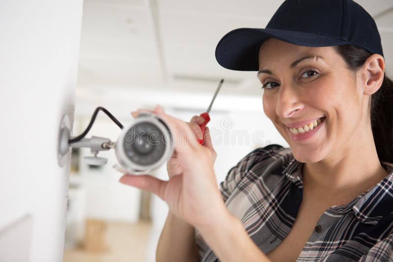 Female Surveillance Camera Installer Smiling Stock Image - Image of cctv, modern: 328787257