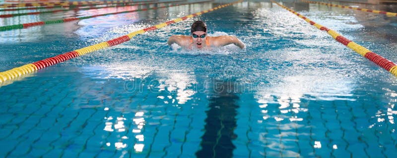Female Swimmer Moving through the Water Performs a Butterfly Stroke ...