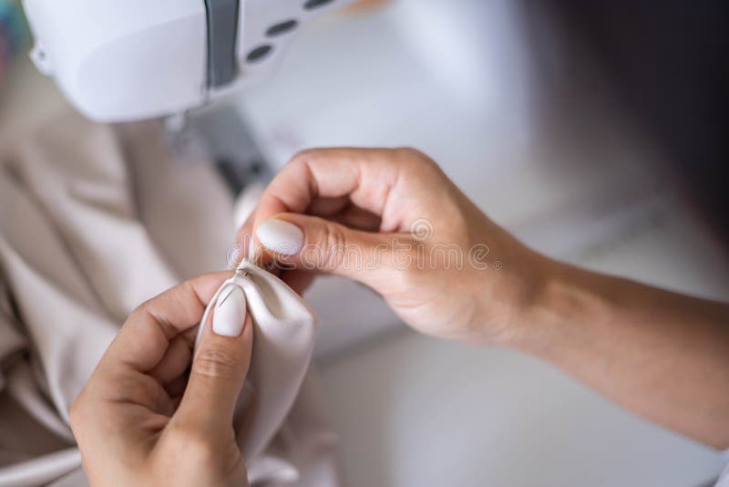 Female Tailor Hands Sewing Beige Textile with Needle and Thread Process ...