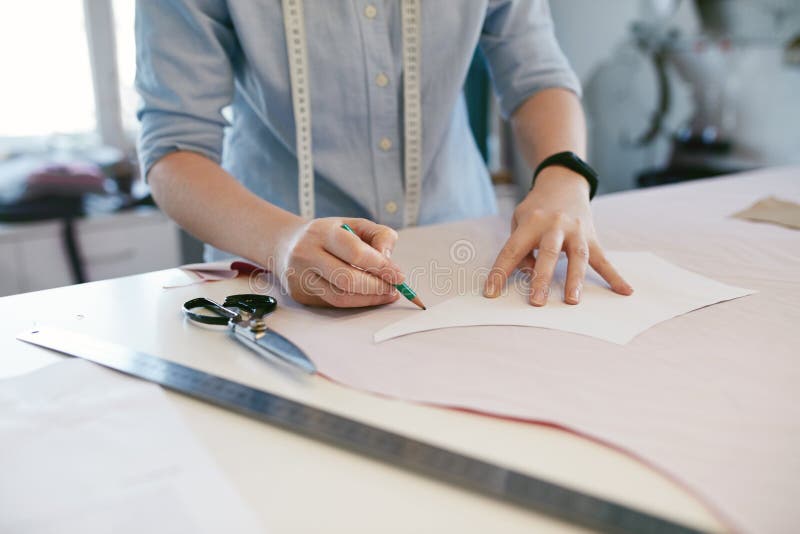 Female Tailor Making Sewing Patterns on Table Stock Photo - Image of ...
