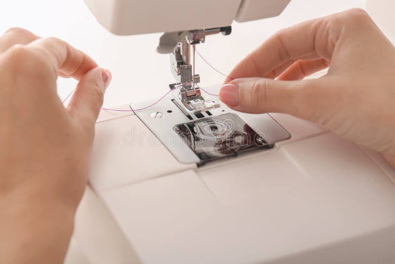 Female Tailor Threading Sewing Machine, Closeup Stock Photo - Image of ...