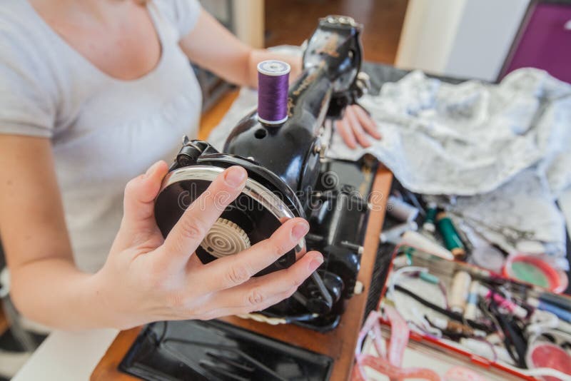 Female Tailor Using Retro Sewing Machine at Home Stock Photo - Image of ...