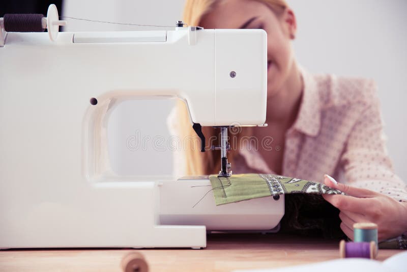 Female Tailor Using Sewing Machine Stock Photo - Image of laundry ...