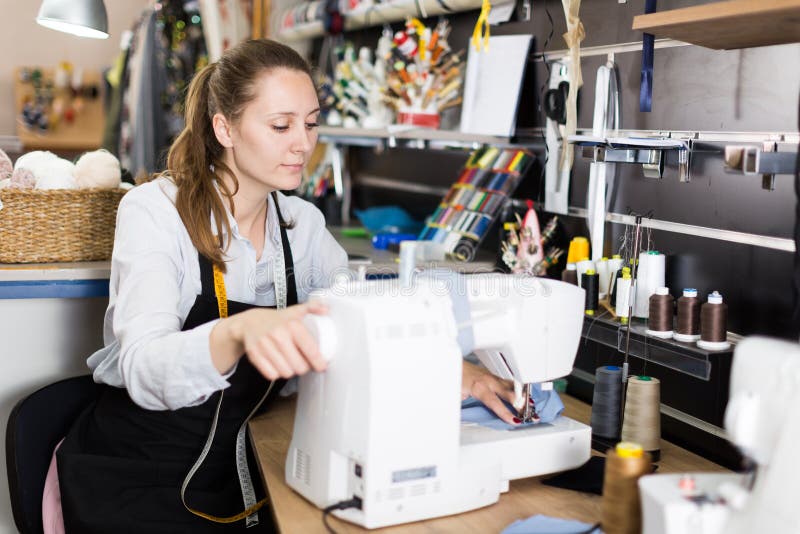 Female Tailor Working with Sewing Machine at Workshop Stock Photo ...