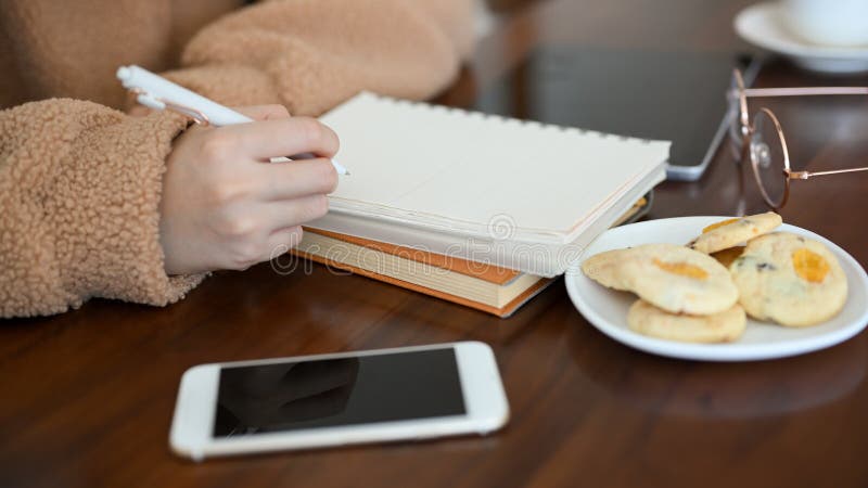 A Female Taking Notes on Her Spiral Notepad Stock Photo - Image of hand ...