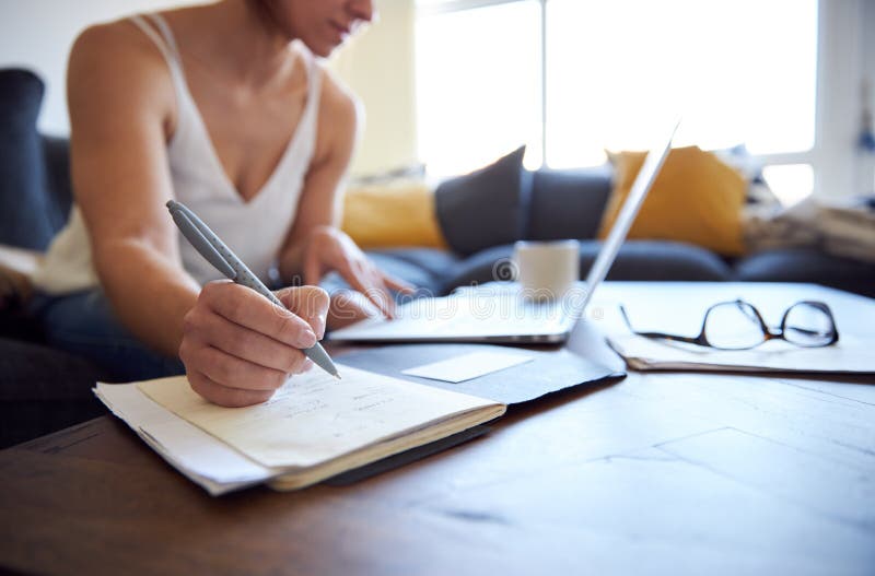 Female Taking Notes Whilst Working from Home Stock Photo - Image of ...