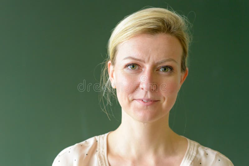 Female Teacher in Class in Front of a Chalkboard Stock Photo - Image of ...