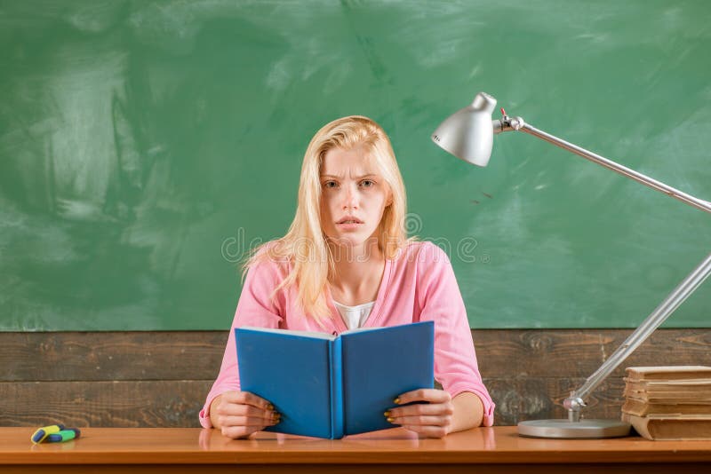 Female Teacher In The Classroom On The Chalkboard College Girl In